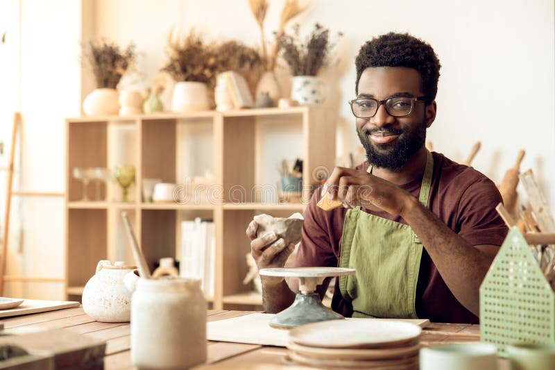 Professional Working in a Pottery Studio on Creation of a New Product ...