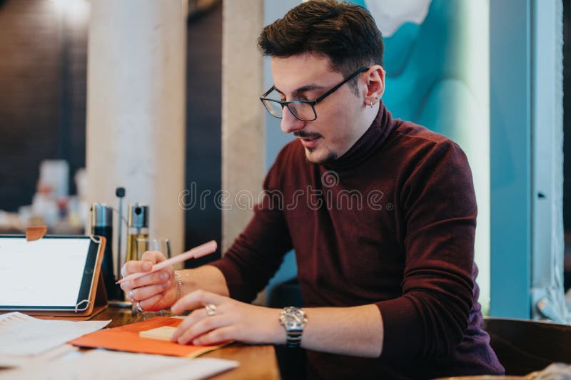 Professional Working on Projects at a Cozy Workspace with Modern Decor ...