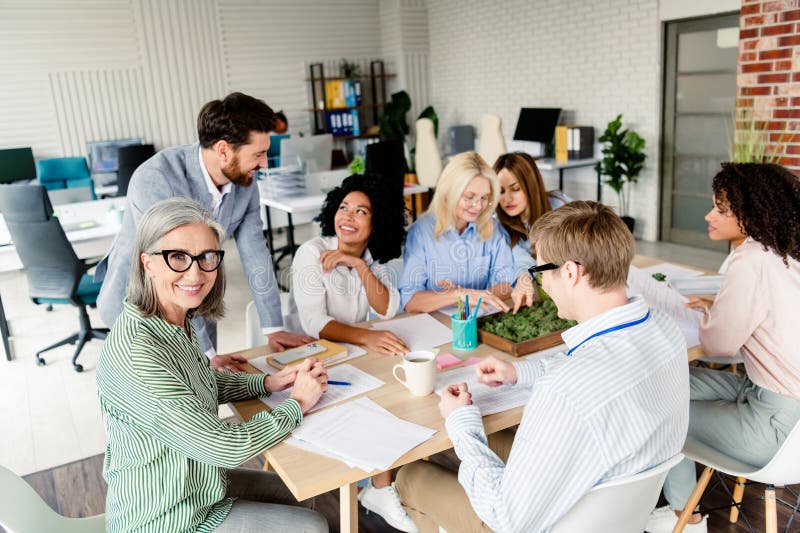 Professional Workplace Team Collaborating on Creative Project in Well ...