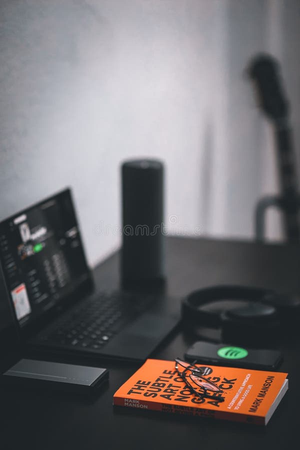 Professional Workspace with a Laptop Computer and a Book by Mark Manson ...