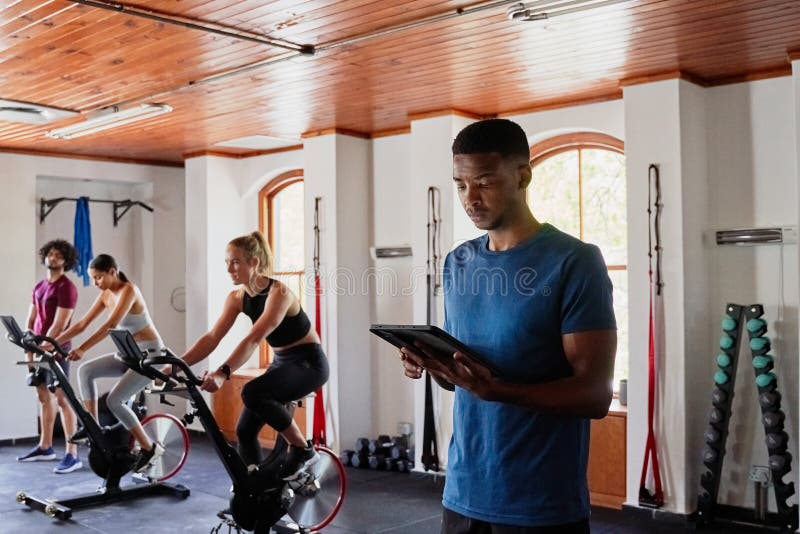 Professional Young Black Man Using Digital Tablet at the Gym Stock ...