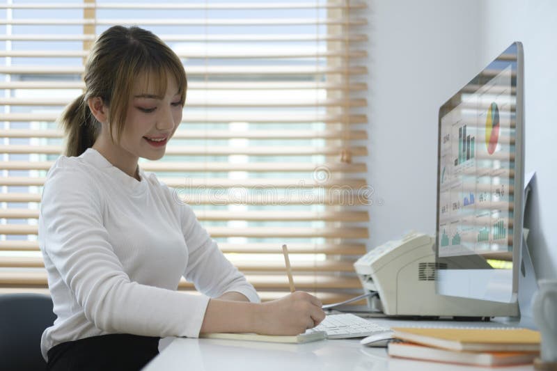 Professional Young Businesswoman Reading Statistics Graphs on Screen of ...