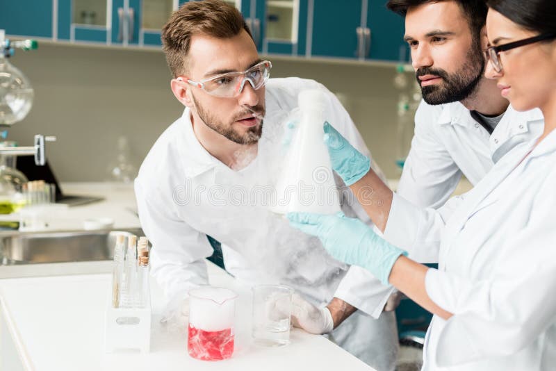 Professional Young Chemists Working Together in Laboratory Stock Photo ...