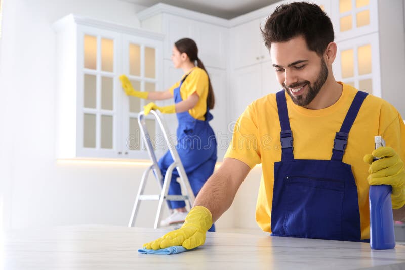 Professional Young Janitor Cleaning Table Stock Image - Image of ...