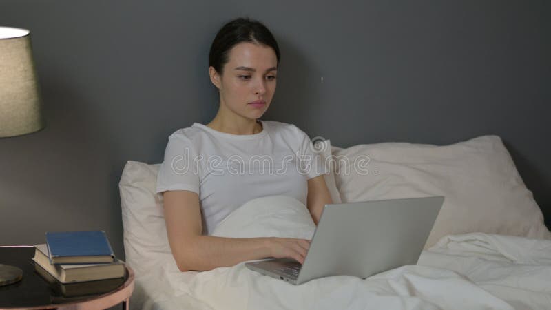 Professional Young Woman Working on Laptop in Bed Stock Photo - Image ...