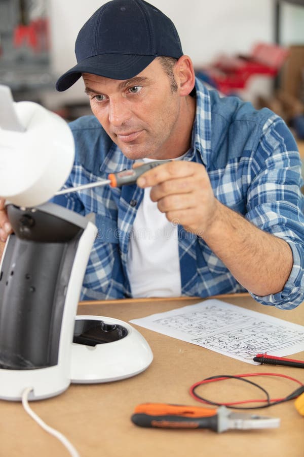 Professional Young Worker Fixing Coffee Machine Stock Image - Image of ...
