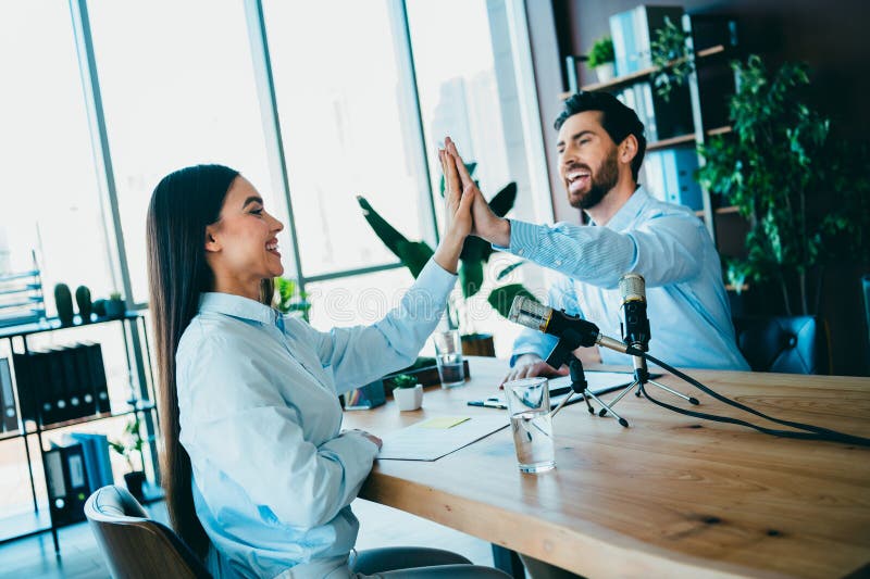Professionals in a Collaborative Coworking Space Celebrating Teamwork ...