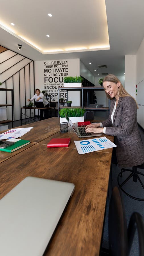 Professionals Engage in Productive Teamwork in a Modern Workspace with ...