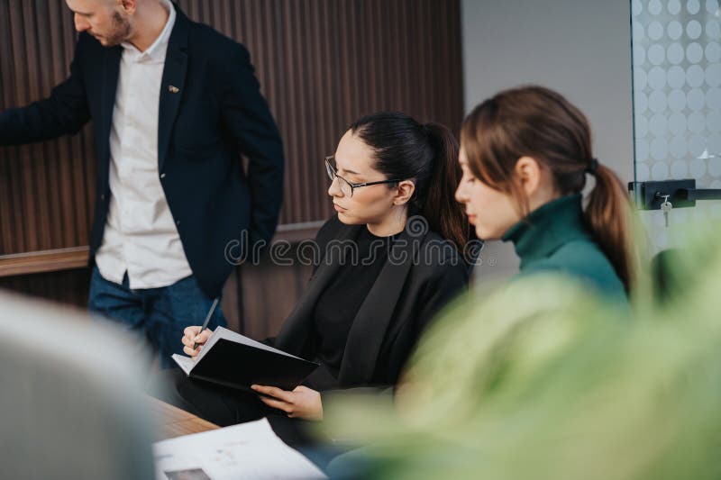 Colleagues Collaborating in a Modern Office Space with Teamwork and ...