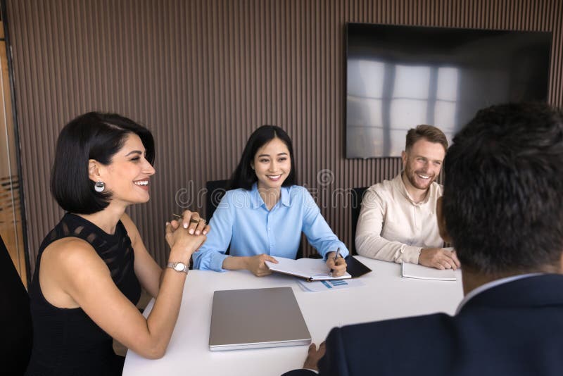 Professionals Engaged in Lively and Collaborative Discussion Seated ...
