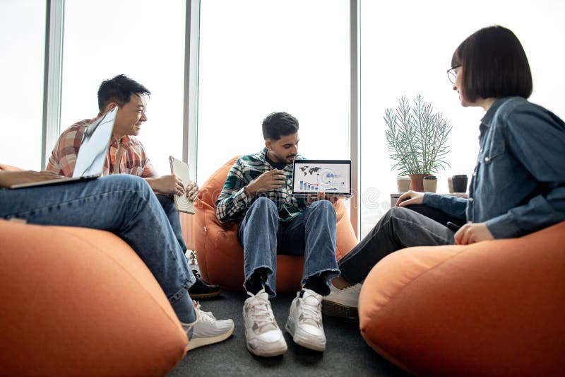 Professionals Enjoying Data Presentation in Charts at Work Stock Image ...
