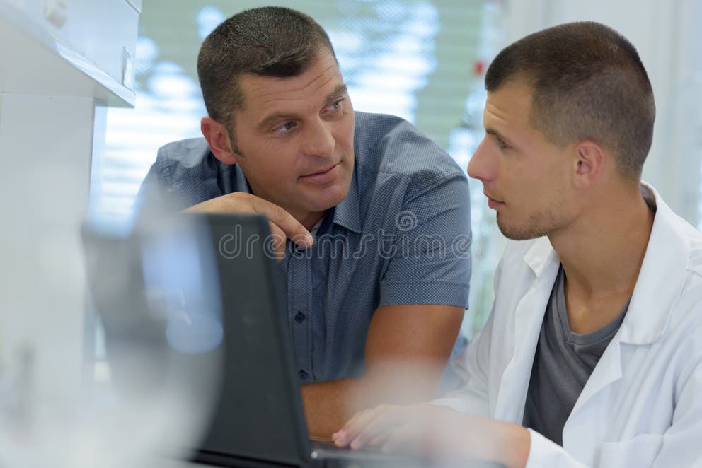 Professionals Talking in Laboratory Stock Photo - Image of science ...