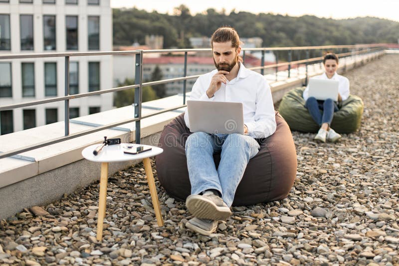 Professionals Working Remotely on Rooftop Workspace Stock Image - Image ...