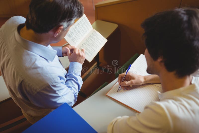 Professor Assisting A Student With Studies Stock Image - Image of ...