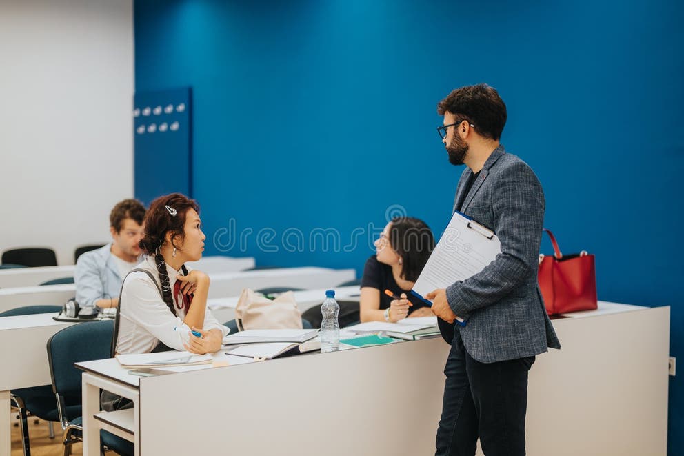 Professor Assisting Students during an Interactive Classroom Session ...