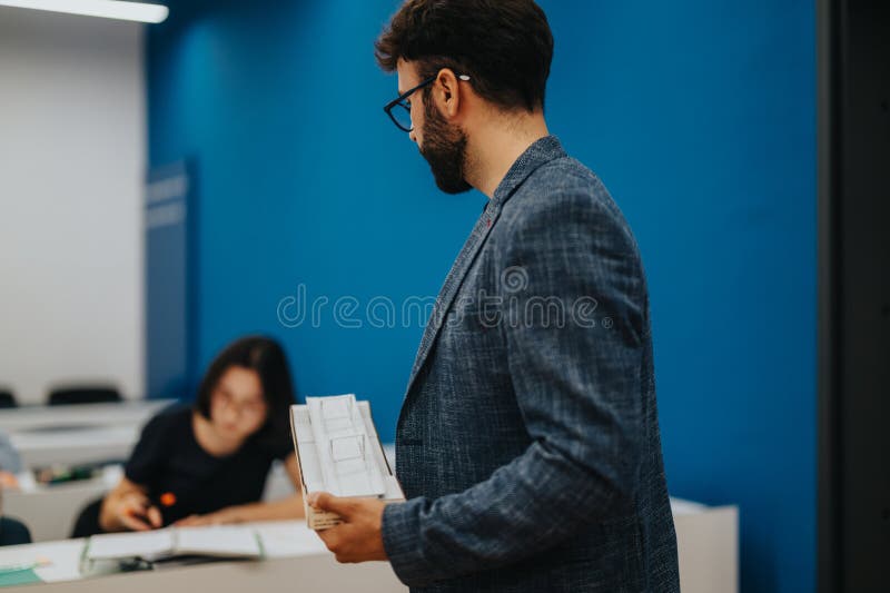 Professor Assisting Students during a Productive Classroom Session ...