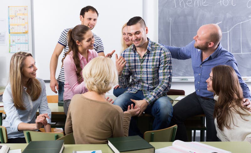 Professor Consulting Different Age Students Stock Photo - Image of ...