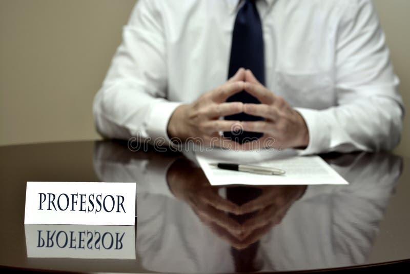 Professor at Desk with Papers and Card Making Hand Gestures Stock Image ...