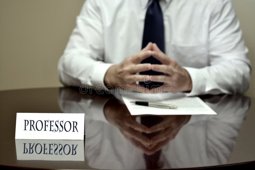 Professor at Desk with Papers and Card Making Hand Gestures Stock Image ...