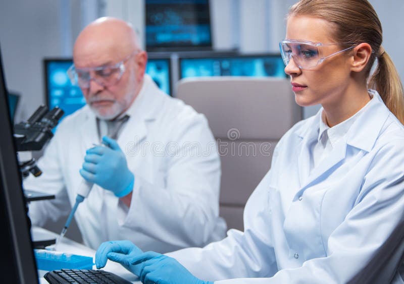 Professor and Doctor Work in a Modern Scientific Laboratory Using ...