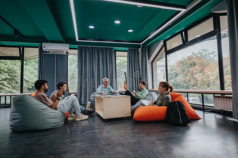 Professor Engaging with Students in Modern Study Lounge Stock Image ...