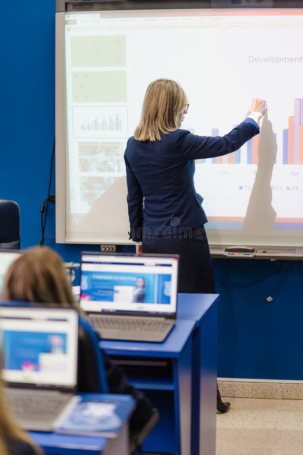 College Students Attending Classes. University Professor Writing on ...