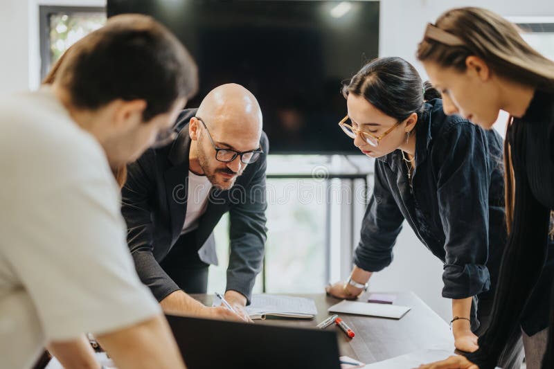 Professor Guiding Students in Collaborative Group Project Meeting Stock ...