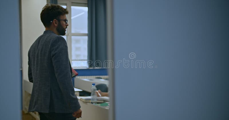 Professor Helping Students during Exam in Classroom Stock Footage ...