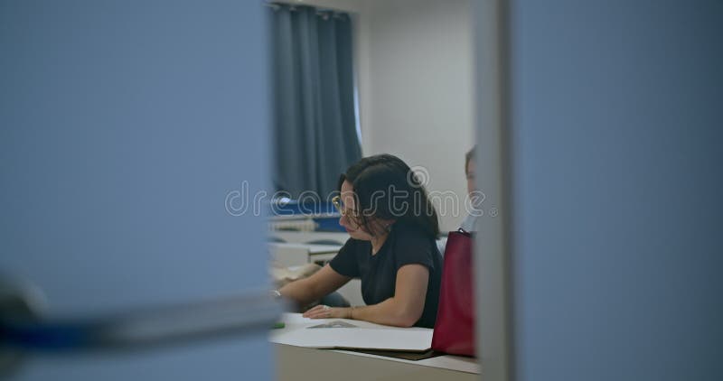 Professor Helping Students during Individual Work or Exam in Class ...