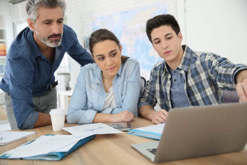 Professor Helping Students on Project Stock Image - Image of mature ...