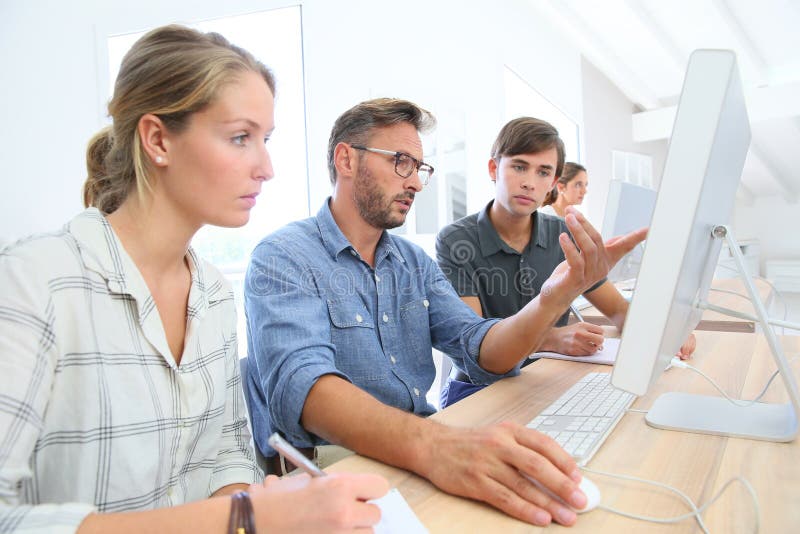 Professor Helping Students with Their Project Stock Photo - Image of ...