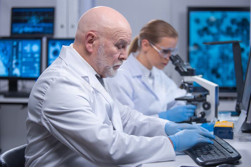 Professor and His Young and Professional Laboratory Assistant are Doing ...