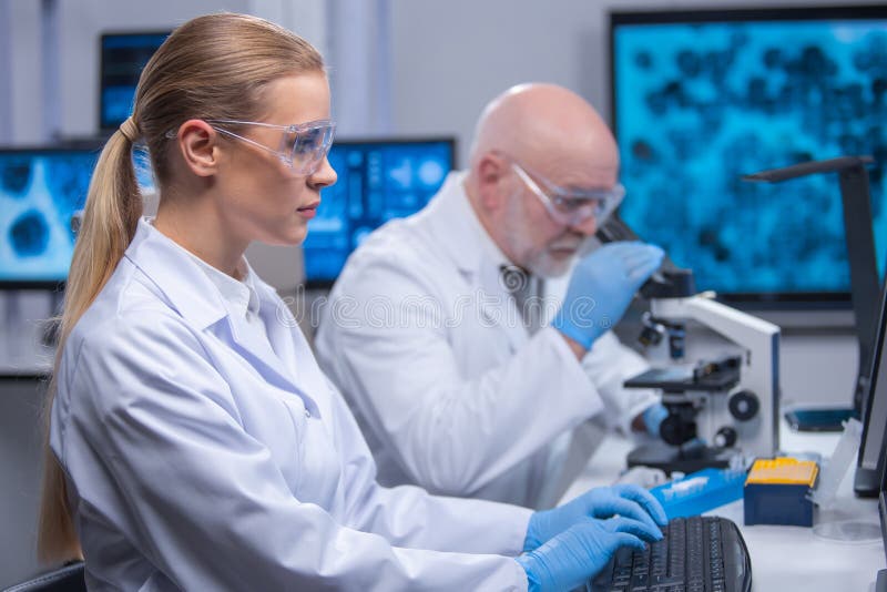 Professor and His Young and Professional Laboratory Assistant are Doing ...