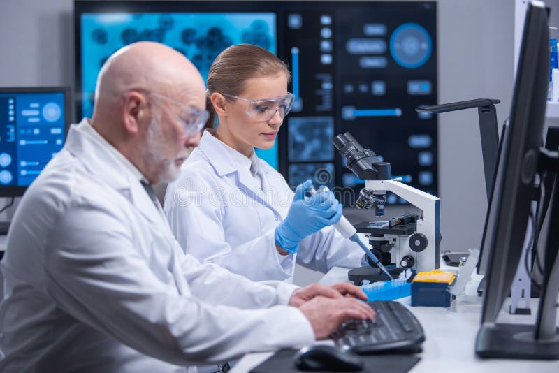 Professor and His Young and Professional Laboratory Assistant are Doing ...