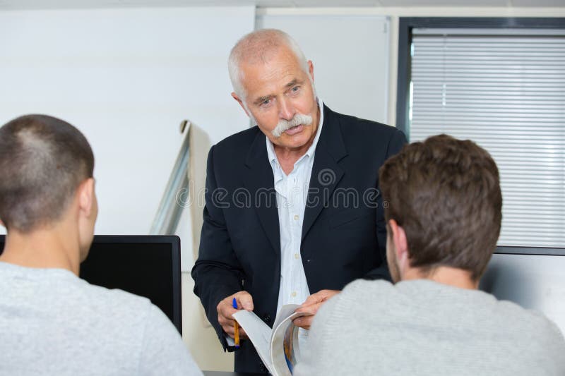 Professor Holding Book in Front Students Stock Image - Image of ...