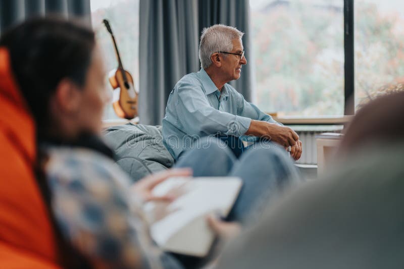Professor Engaging with Students in a Relaxed Classroom Setting Stock ...