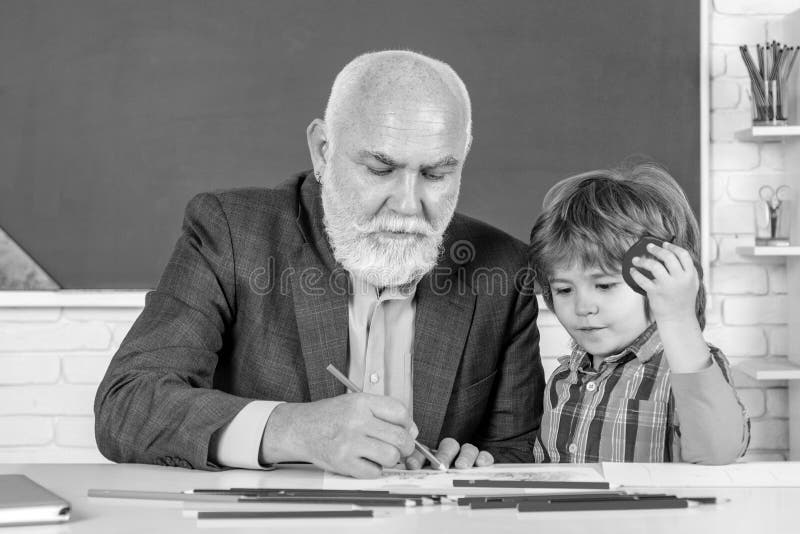 Professor and Pupil in Classroom at the Elementary School. Elementary ...