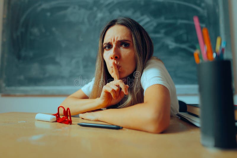 Strict Teacher Asking for Silence in the Classroom Stock Photo - Image ...