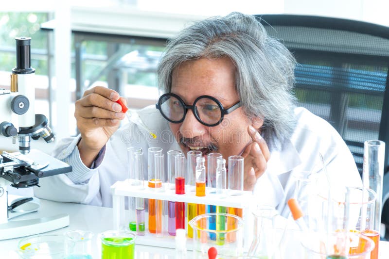 Professor Research Scientist Preparing and Analyzing Pipetting Solution ...