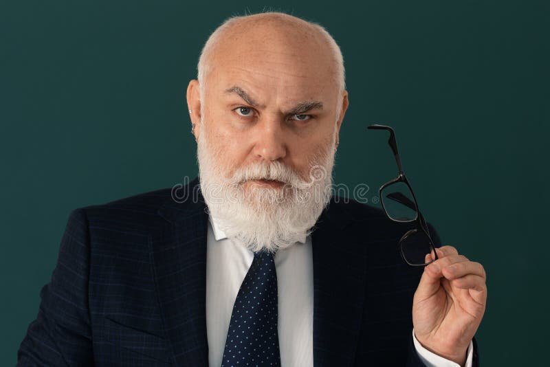 Professor Or Serious Teacher Elderly Man Teacher On A Blank Chalkboard