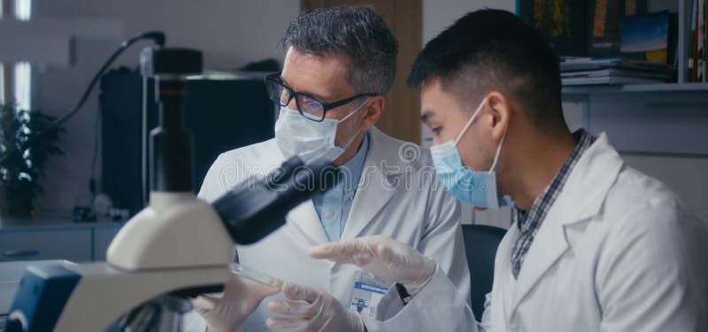 Professor and Student Discussing in Laboratory Stock Image - Image of ...