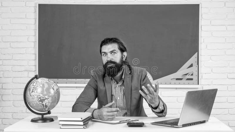 Professor or Teacher Sitting at His School Desk, Education Stock Photo ...