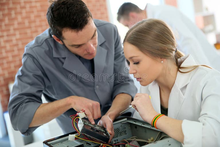 Professor Teaching Young Students Basics of Hardware Stock Photo ...