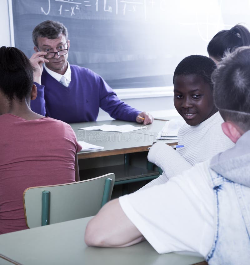Professor Watching As Student Write Off on Exams Stock Image - Image of ...