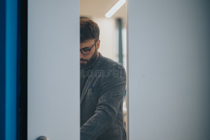 Professor in a Professional Outfit Entering a Classroom through Door ...