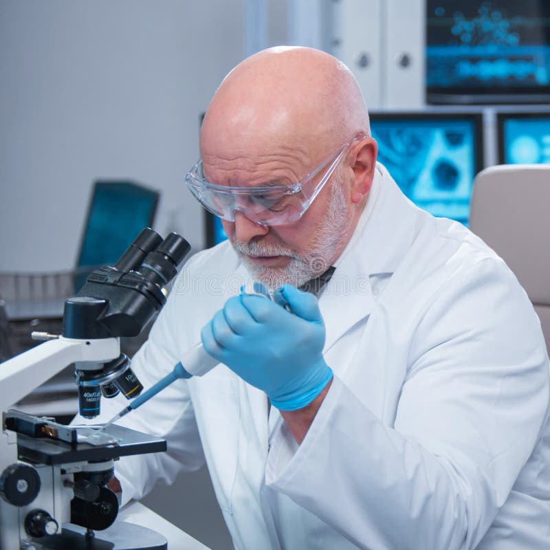 Professor Works in a Modern Scientific Laboratory Using Equipment and ...