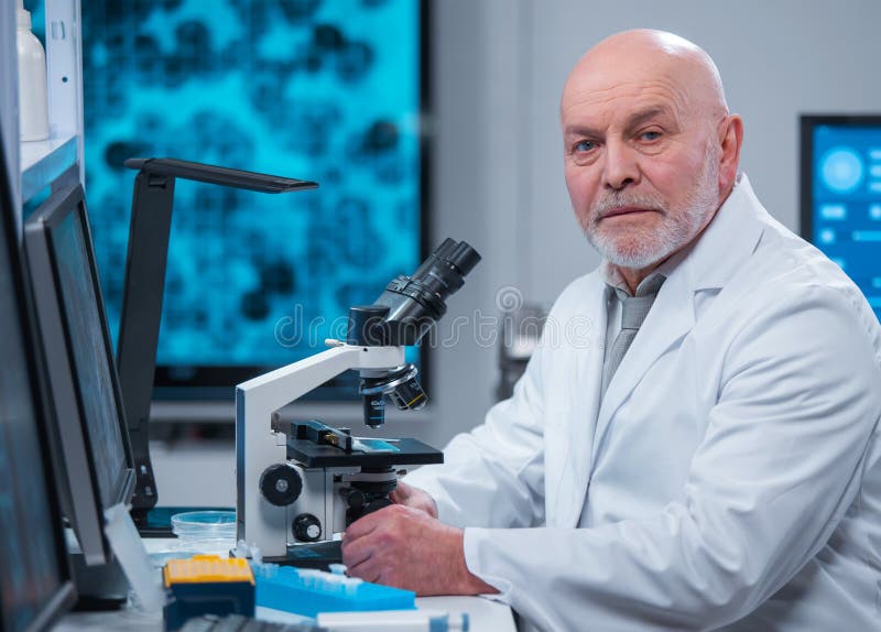 Professor Works in a Modern Scientific Laboratory Using Equipment and ...