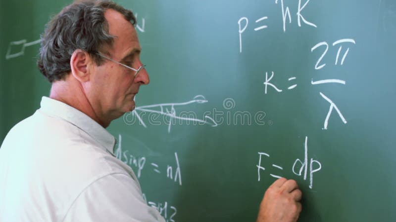 Professor Writes Formulas for Force of Newtons Stock Video - Video of ...