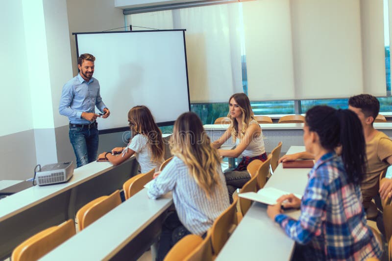 Proffesor Giving Presentation in Lecture Hall at University Workshop ...
