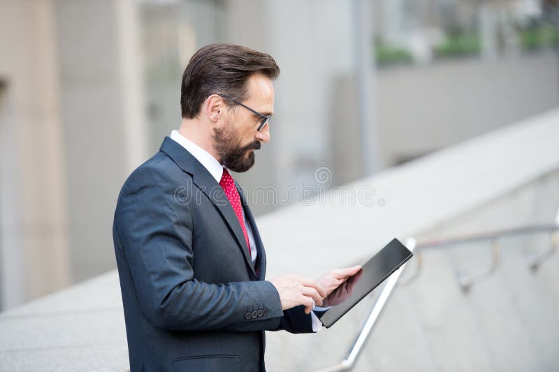 Profile of Concentrated Mature Manager Using a Tablet in the Street ...